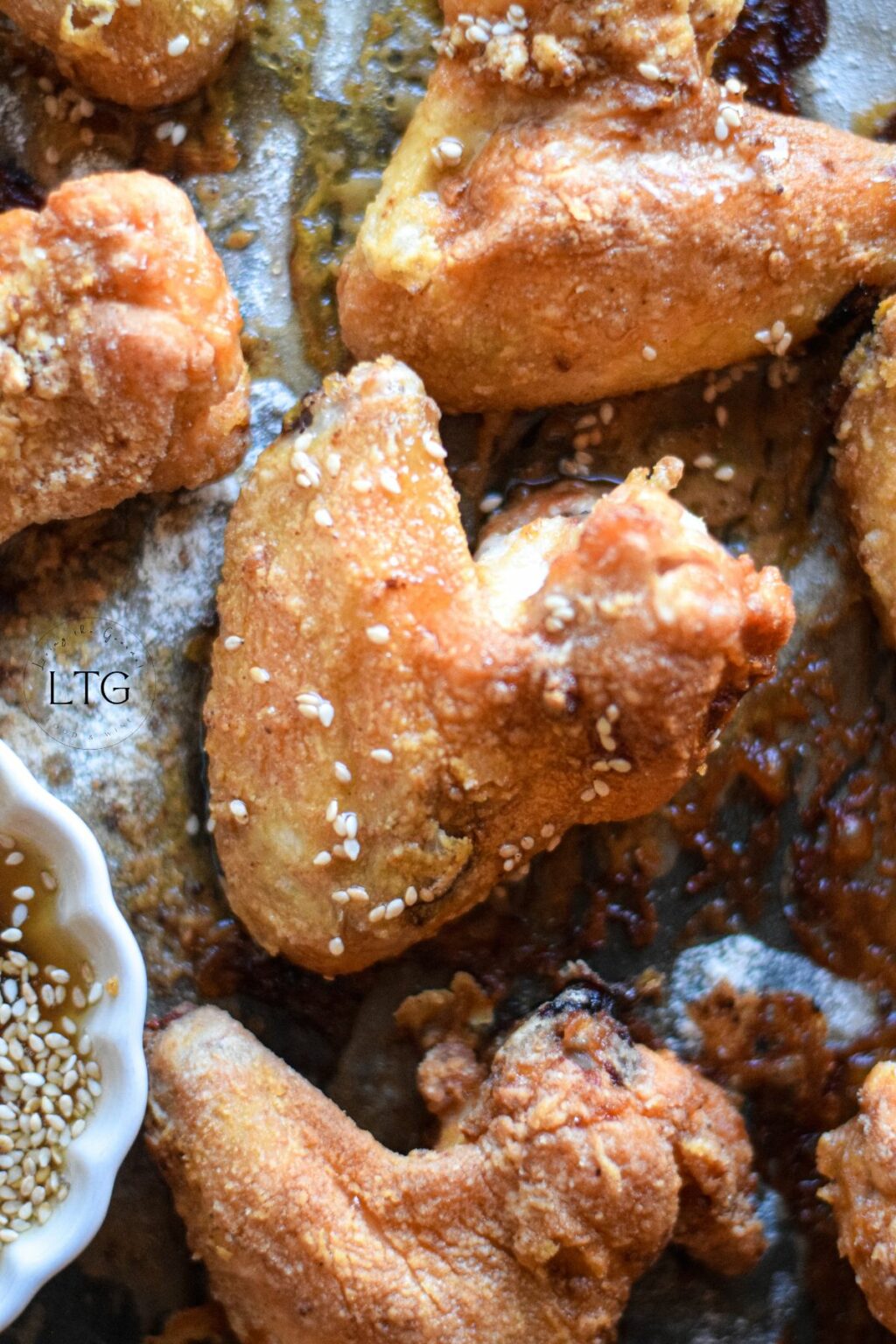 Spicy Sesame Garlic Chicken Wings - Living The Gourmet